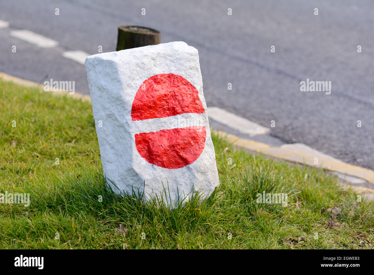 No entry road sign painted onto rock on side of road in Reigate, Surrey ...