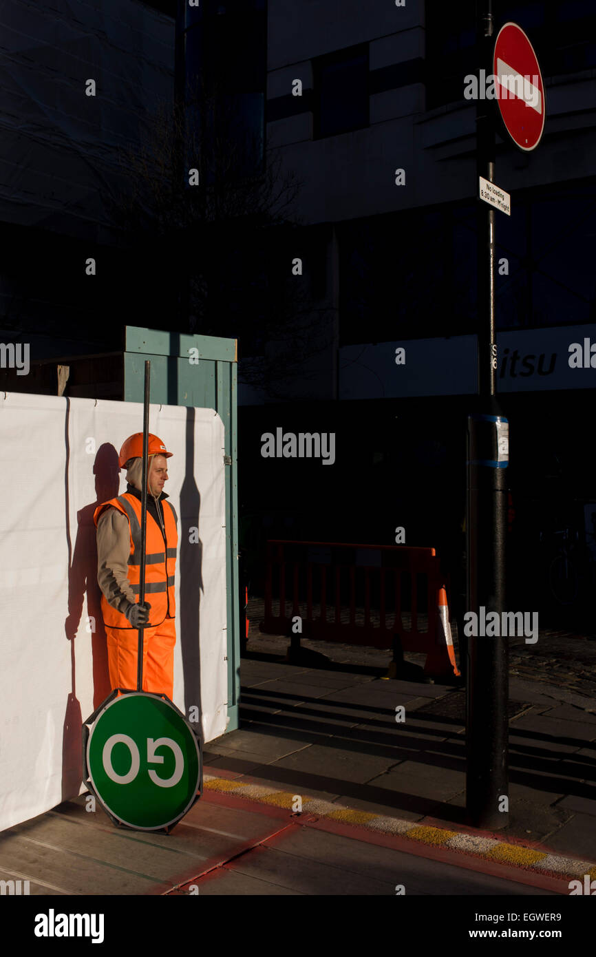 Construction site Banksman (Traffic Marshal) waits to control local ...