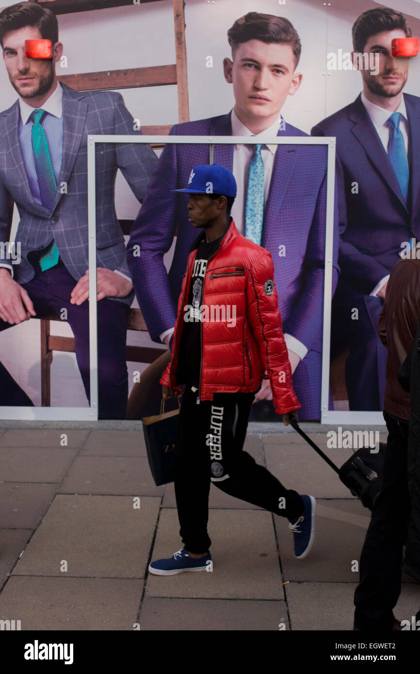 Construction hoarding featuring suited young men for dress hire ...