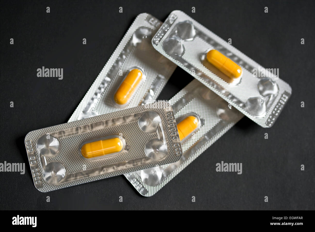 Gelatine capsules with medicine in aluminium packages Stock Photo - Alamy