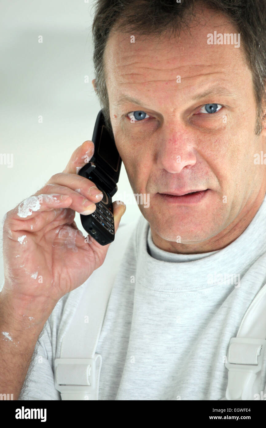 Decorator on the phone Stock Photo - Alamy
