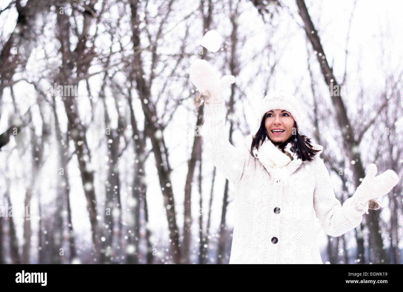 Woman throwing snowball hi-res stock photography and images - Alamy