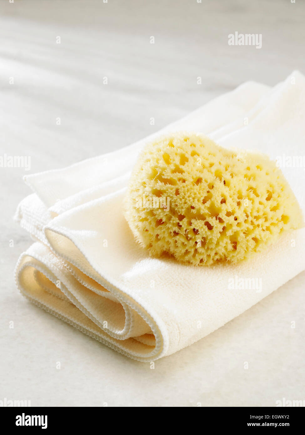 natural sponge on the soft towel Stock Photo - Alamy