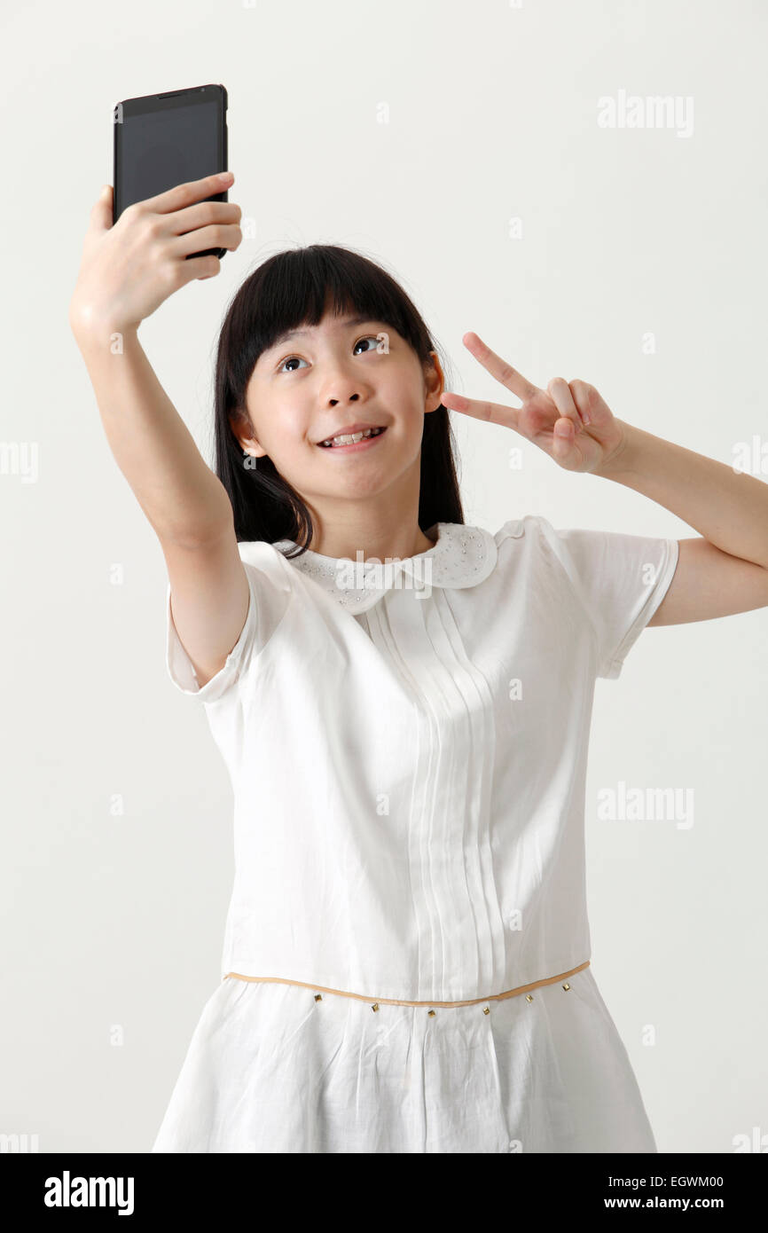chinese girl self portrait with smart phone Stock Photo - Alamy