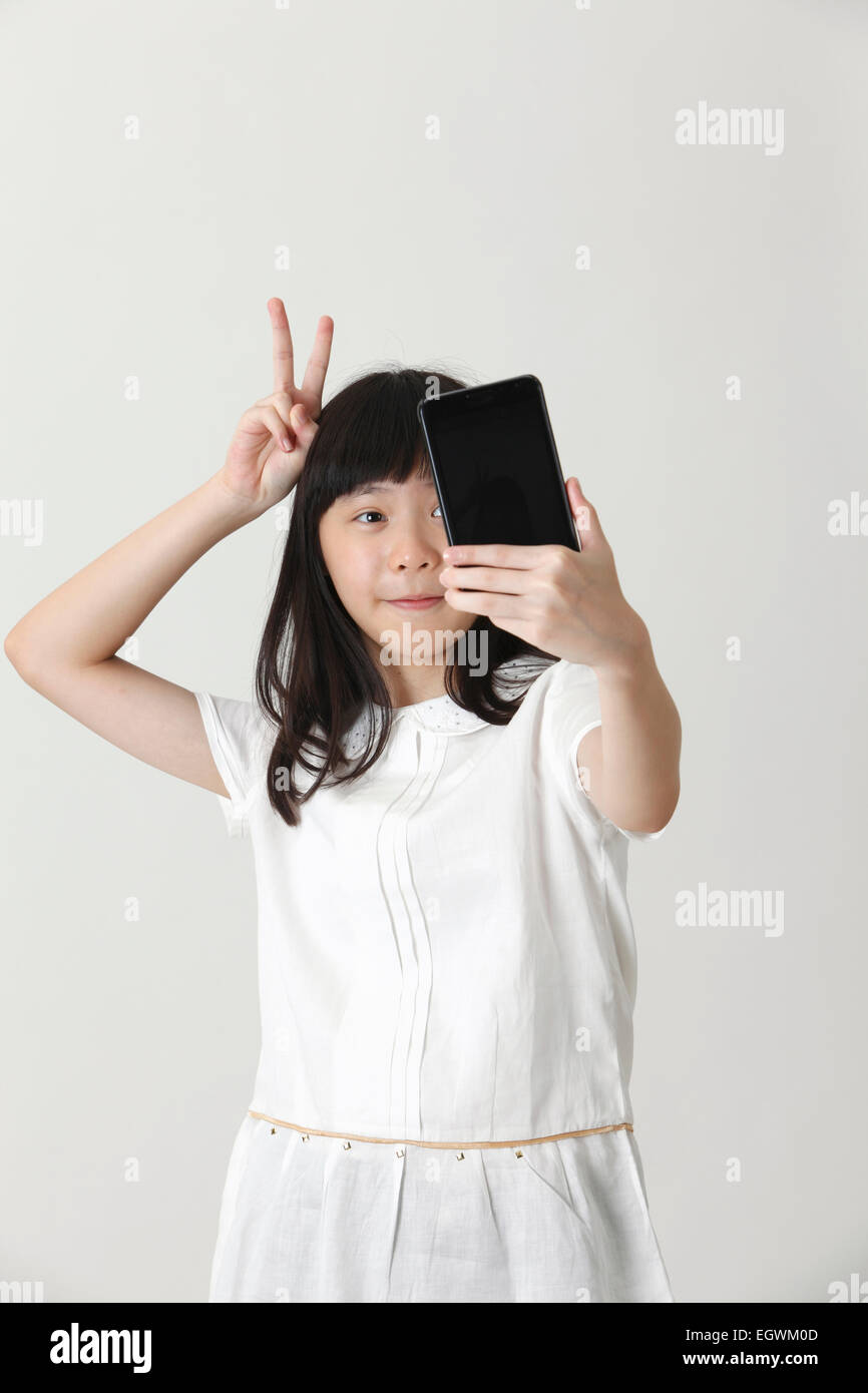 chinese girl self portrait with smart phone Stock Photo - Alamy