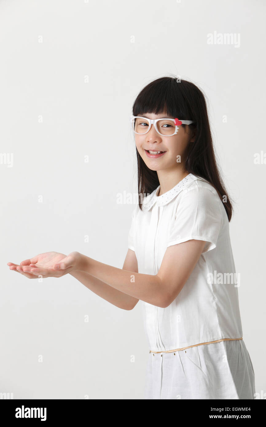chinese girl bring up her hand to receive Stock Photo - Alamy