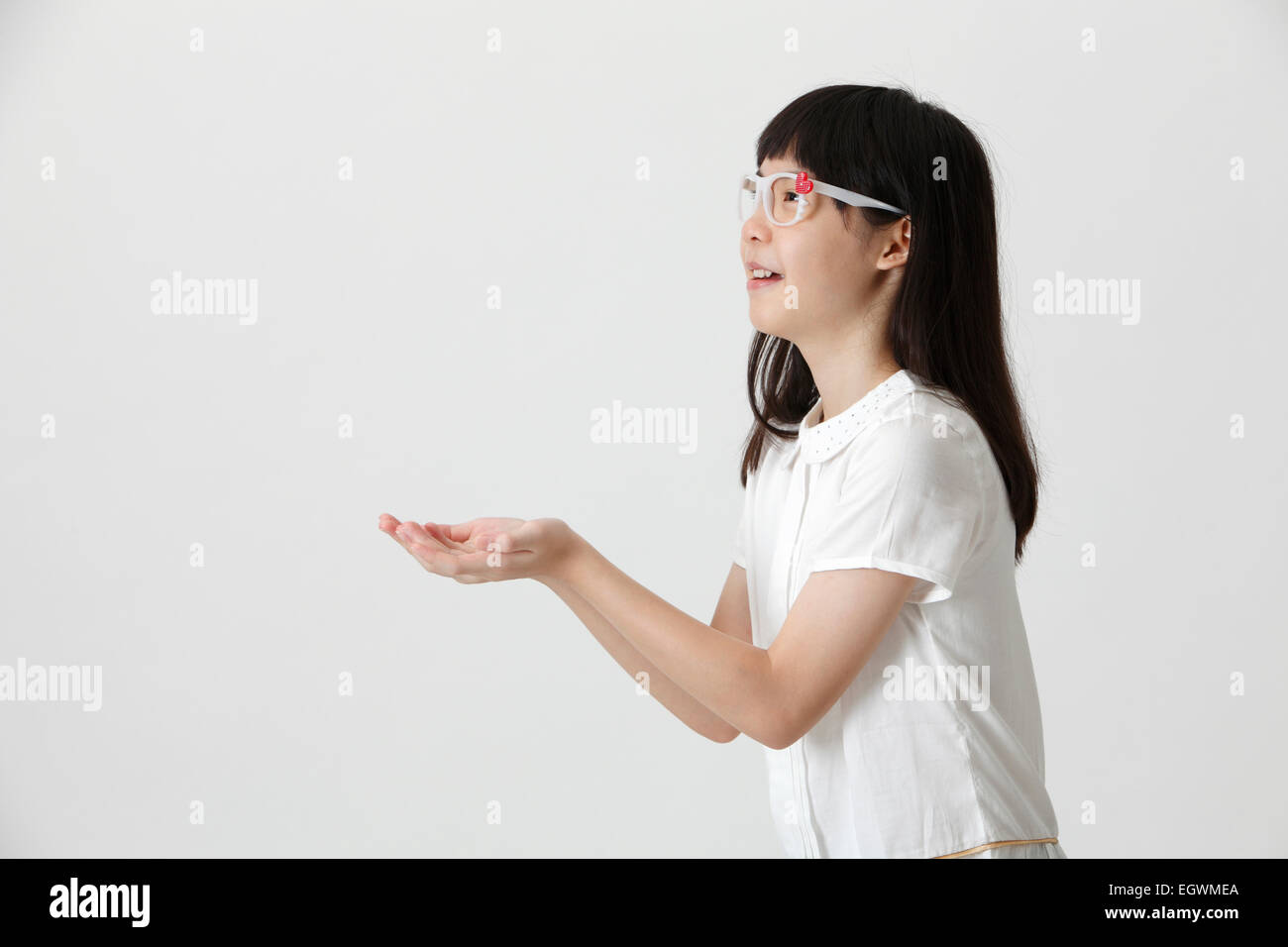 chinese girl bring up her hand to receive Stock Photo - Alamy