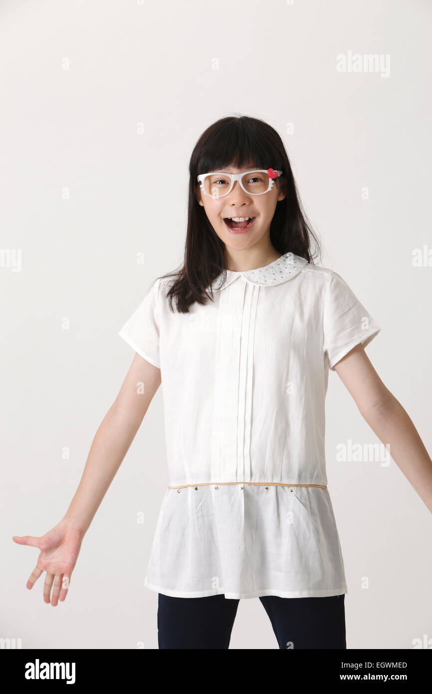 happy girl standing with hand open Stock Photo - Alamy