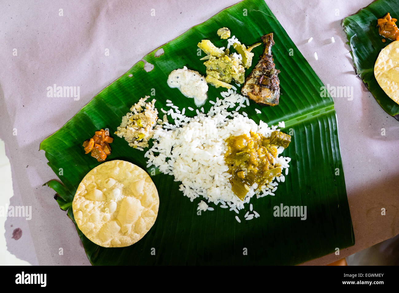 Traditional Keralan vegetarian thali meal lunch served on a banana leaf ...