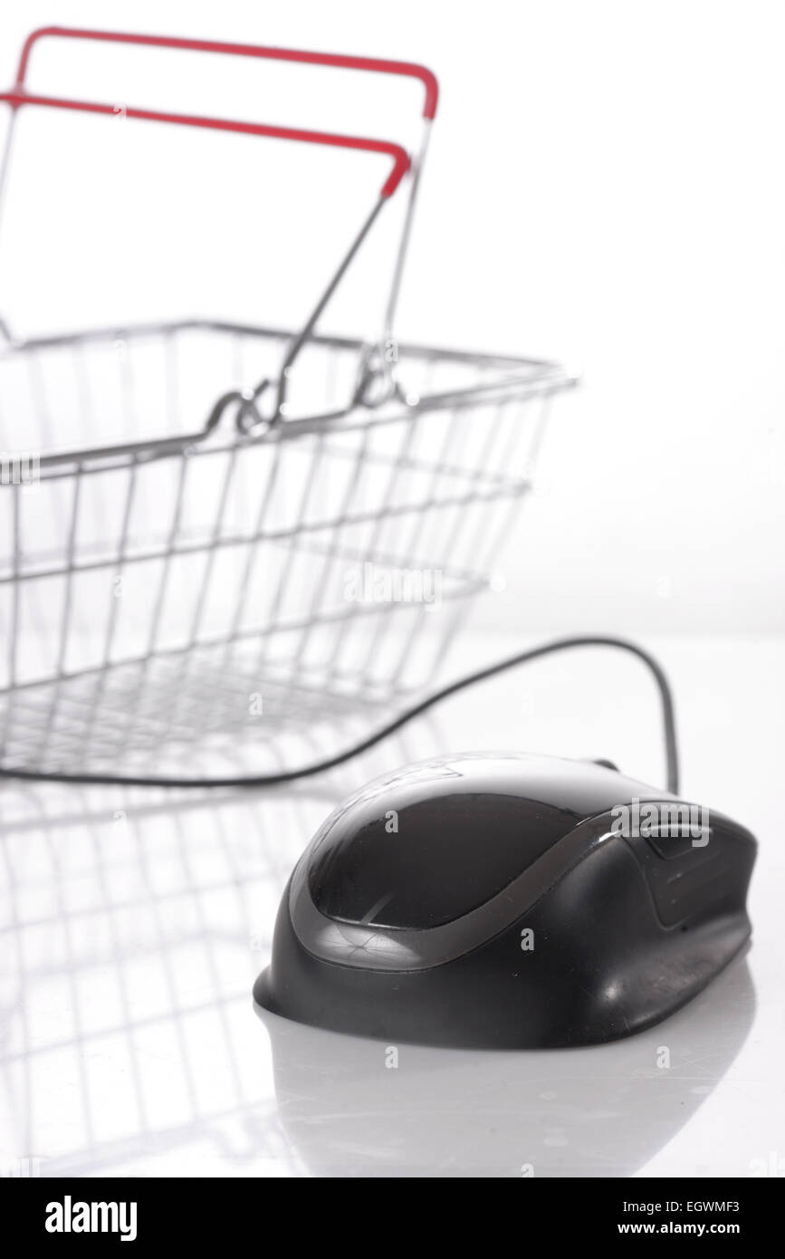 Computer mouse connected to shopping basket on white background Stock ...
