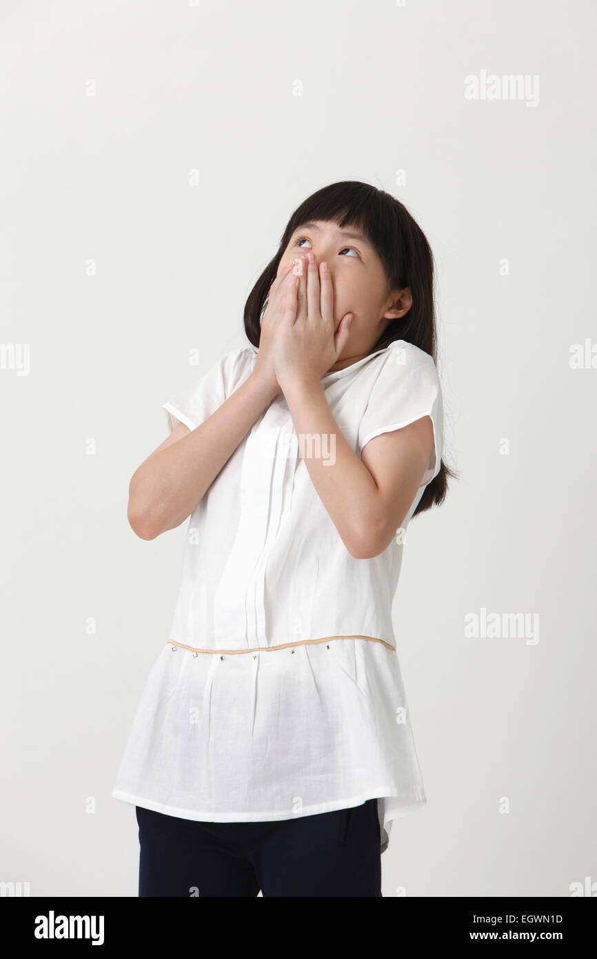 chinese girl with surprise expression and looking up Stock Photo - Alamy