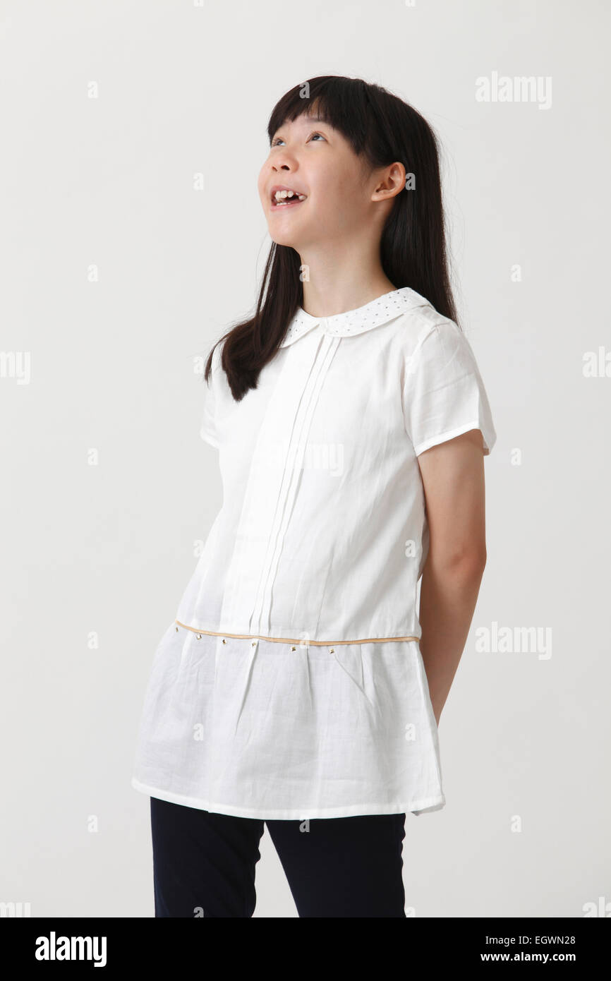 chinese girl with surprise expression and looking up Stock Photo - Alamy