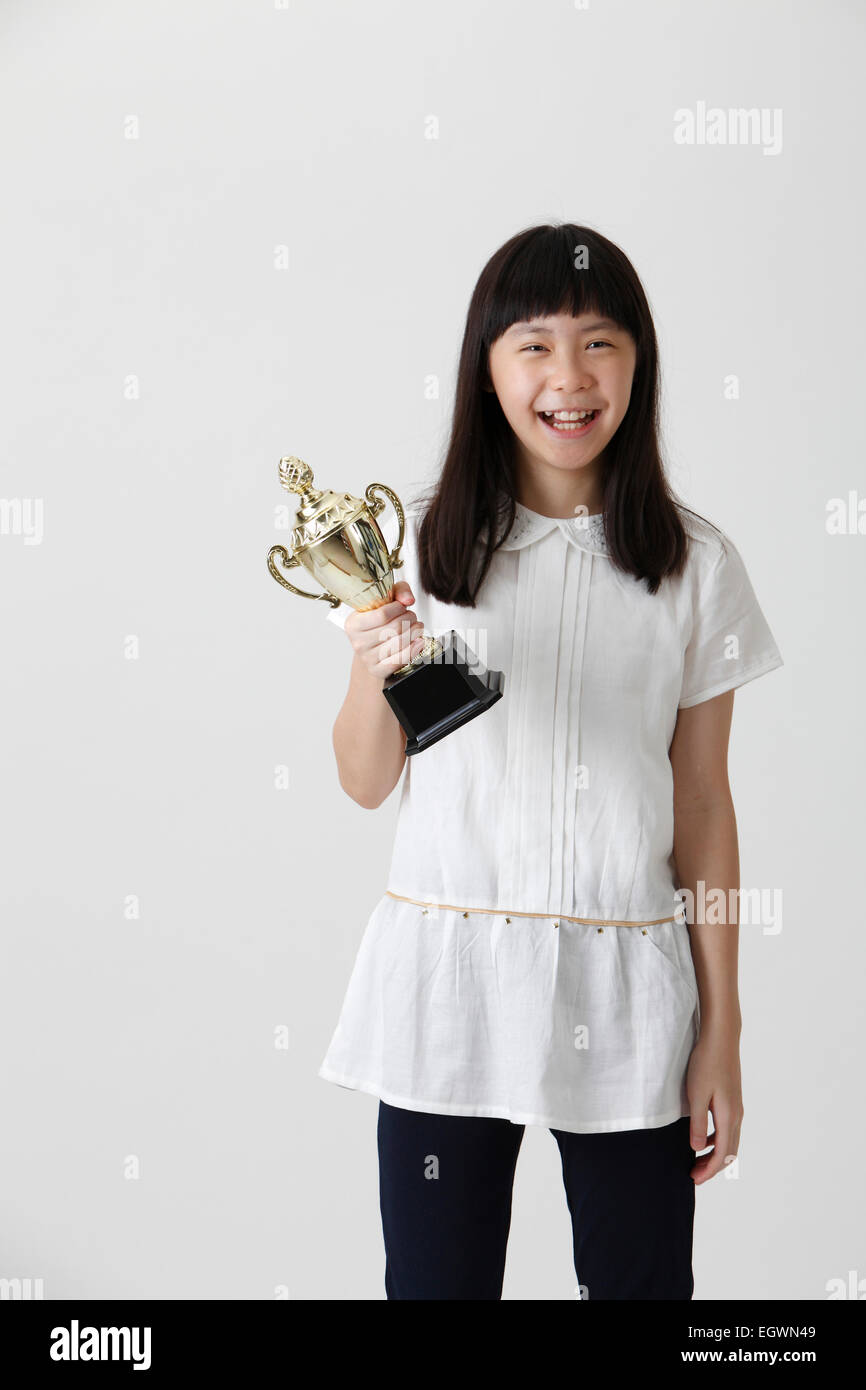 girl happy to own a trophy Stock Photo - Alamy