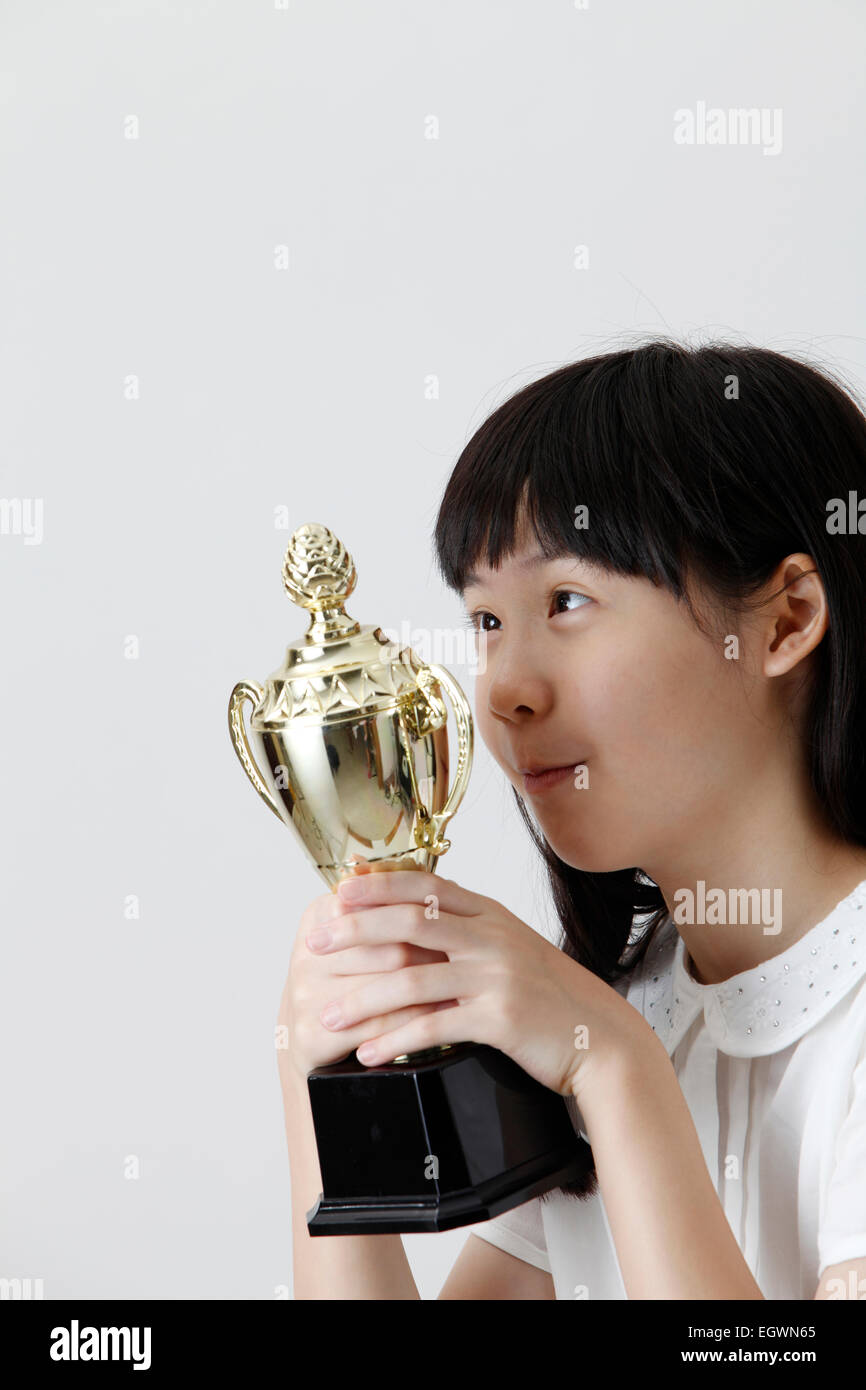 girl happy to own a trophy Stock Photo - Alamy