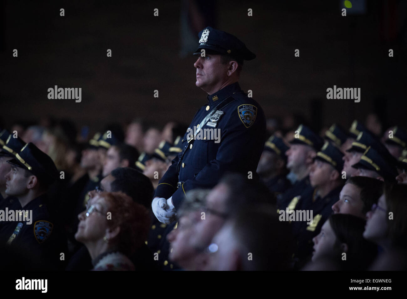 Manhattan, New York, USA. 2nd Mar, 2015. A police officer looks on ...