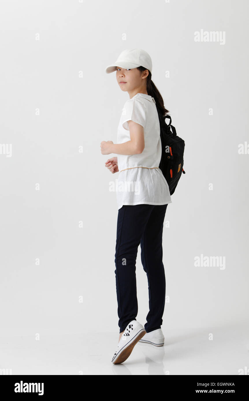 chinese girl in the walking position looking back Stock Photo - Alamy
