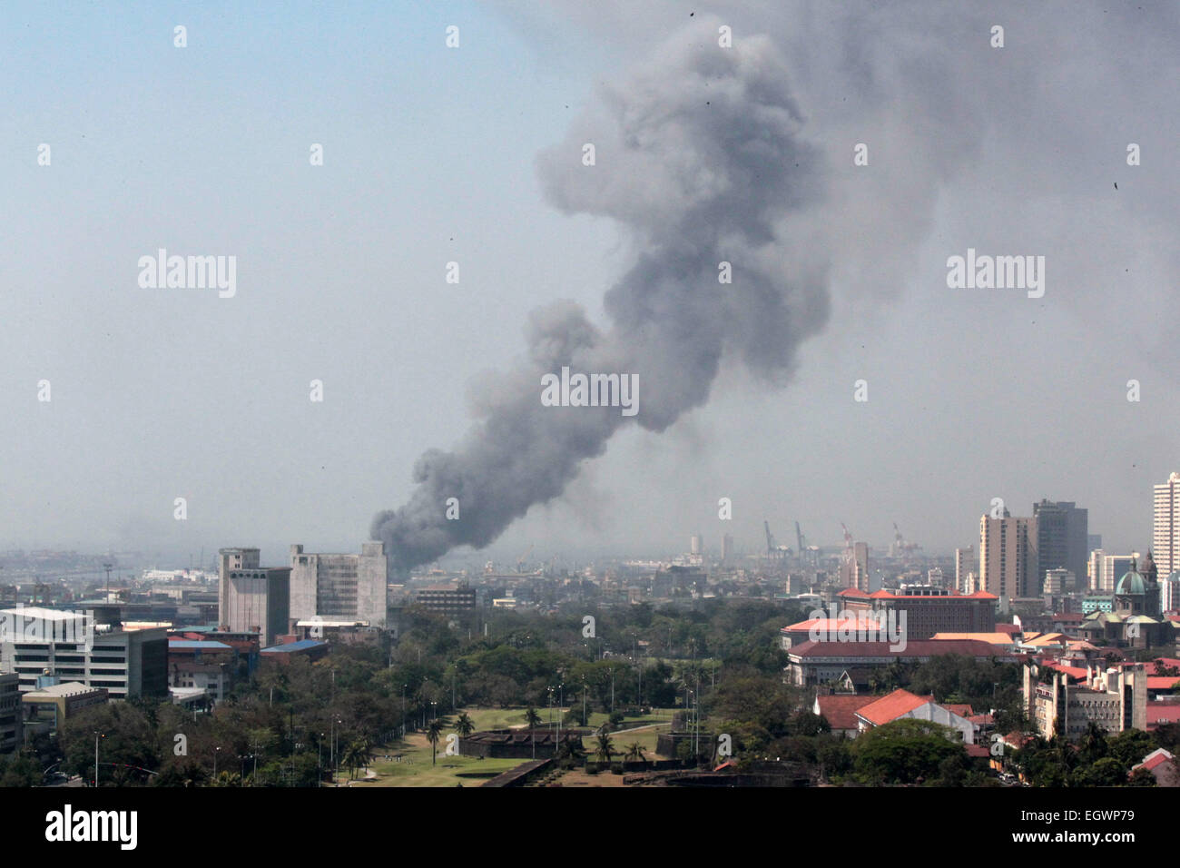 Manila, Philippines. 3rd Mar, 2015. Smoke billows from a fire at a slum ...