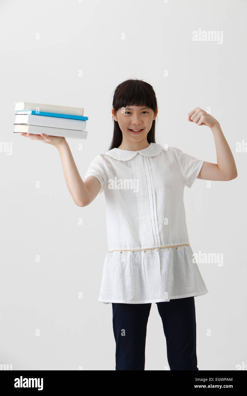 chinese girl showing stack of books Stock Photo - Alamy