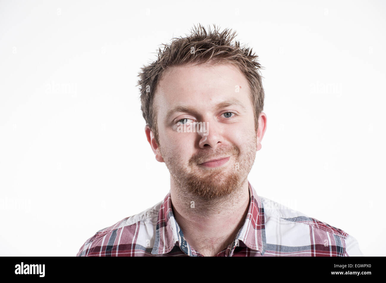 head and shoulders shot of the face of a friendly and happy 20 ...