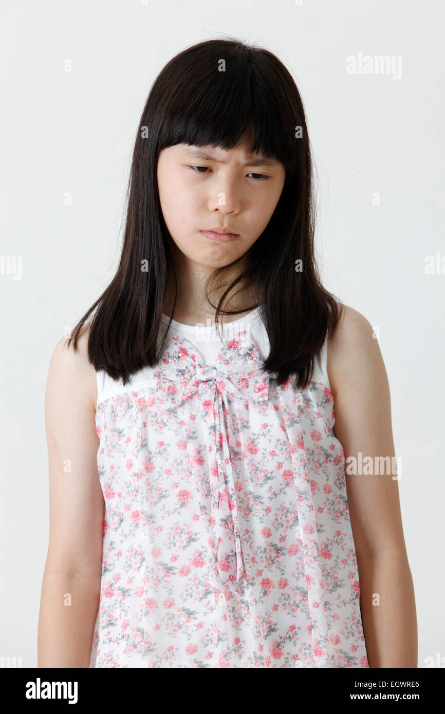 chinese girl with sad expression Stock Photo - Alamy