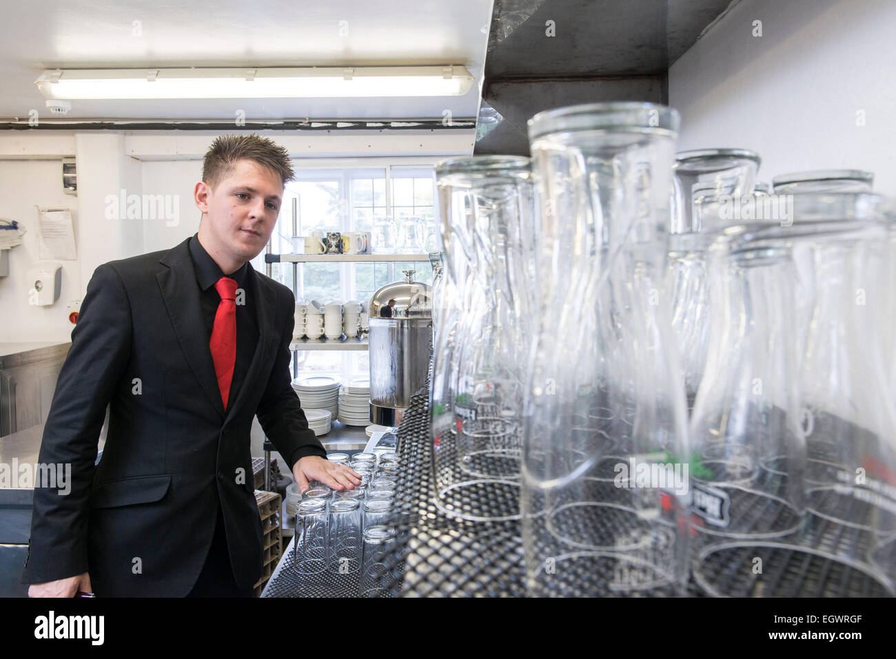 a hotel worker checks and manages various aspects of day to day hotel ...