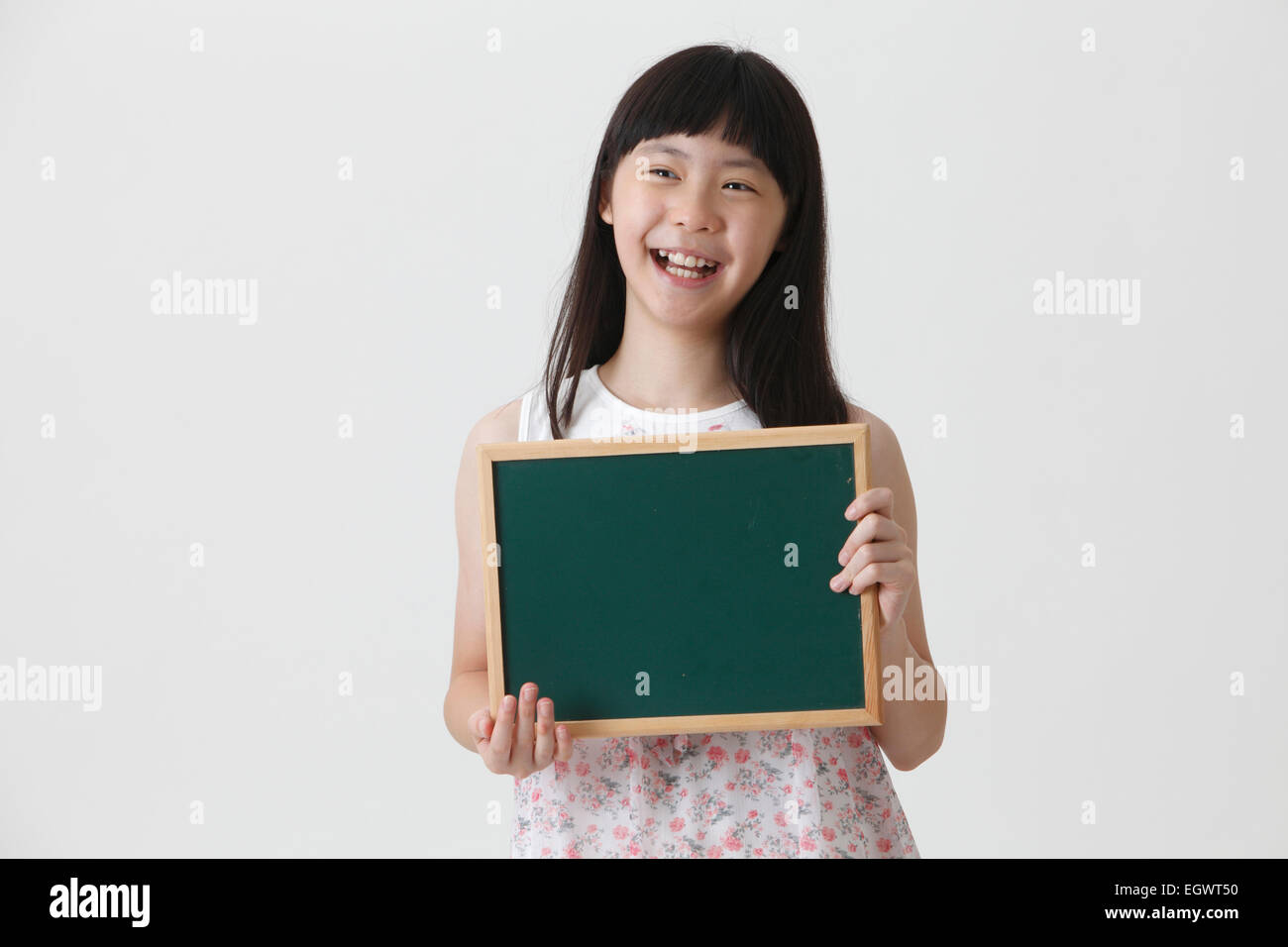 chinese girl holding a small chalk board Stock Photo - Alamy