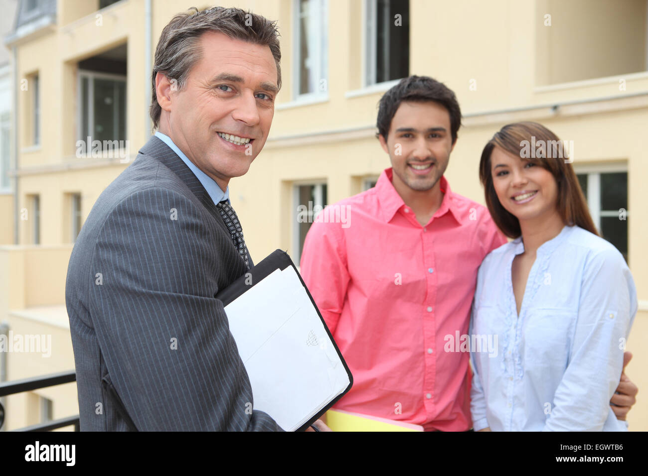 Young couple buying a house Stock Photo - Alamy