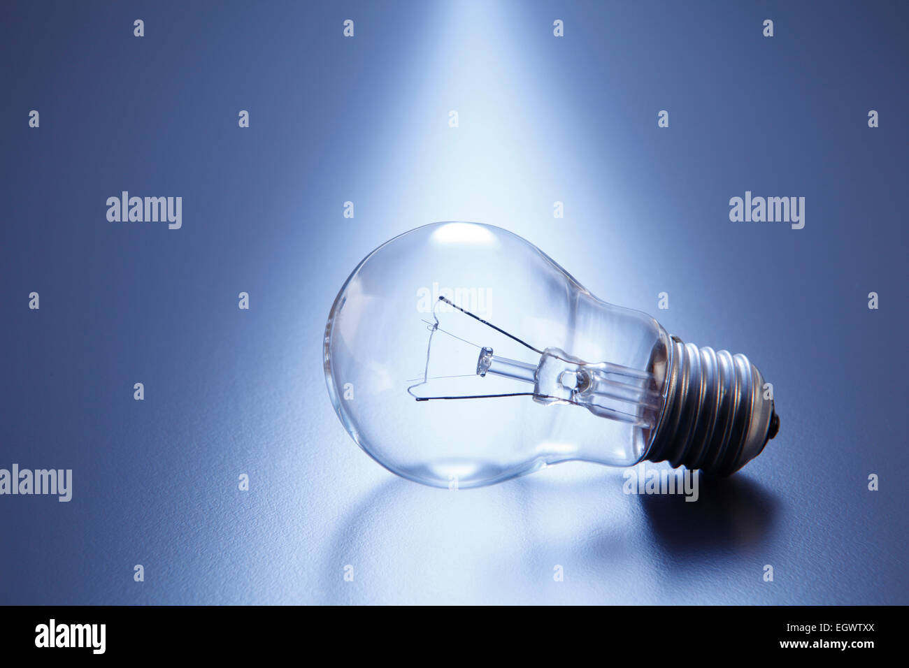 light bulb on the blue background Stock Photo - Alamy