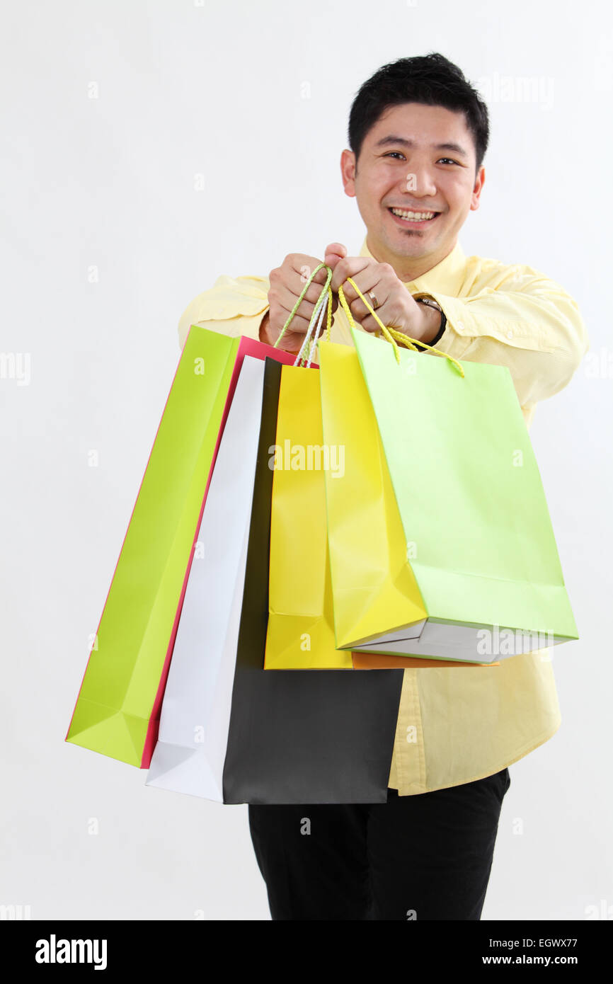 Chinese man holding shopping bags hi-res stock photography and images ...