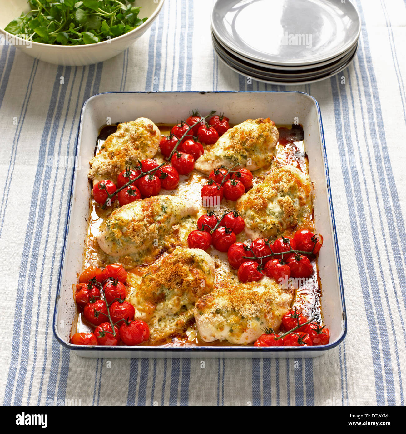 Chicken with pesto, Taleggio, and roasted tomatoes Stock Photo - Alamy