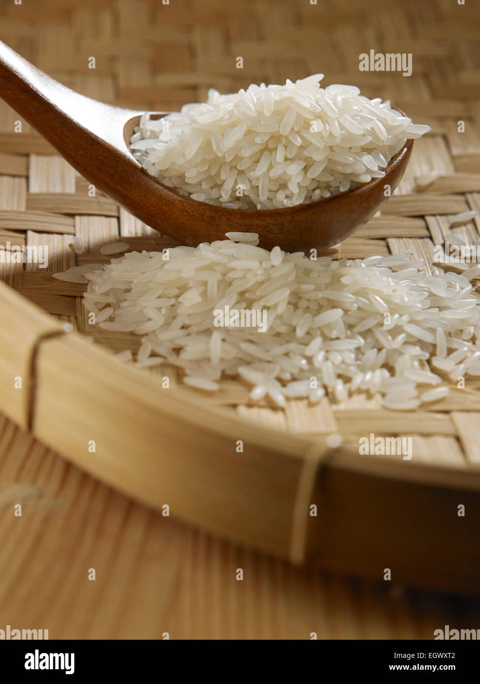 spoon full of rice on bamboo tray Stock Photo - Alamy