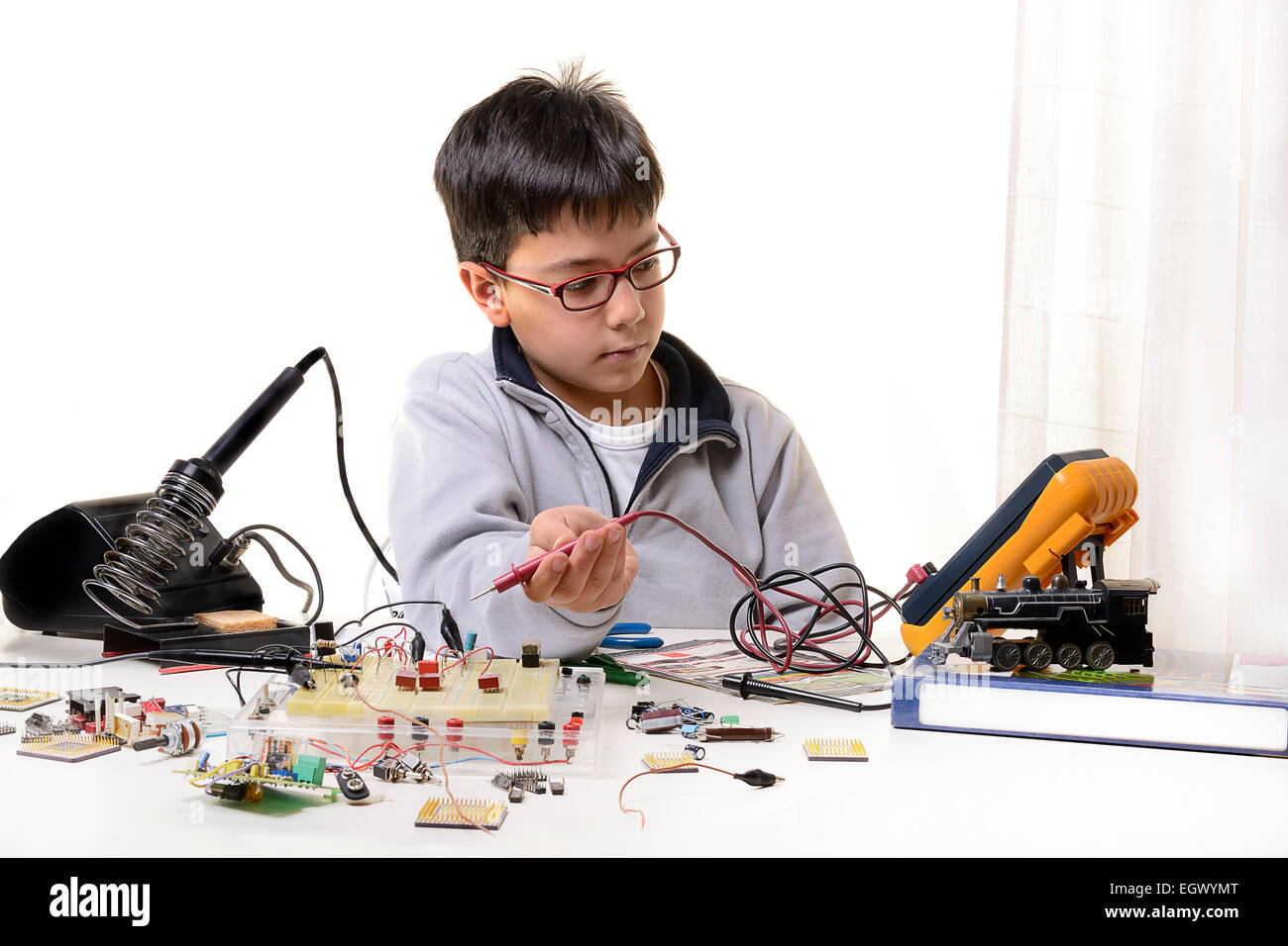 Young student performs experiments in electronics and dreams of the ...