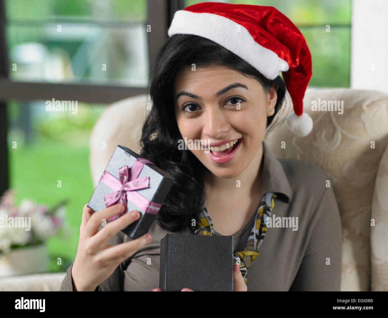 Beautiful woman christmas present hi-res stock photography and images ...