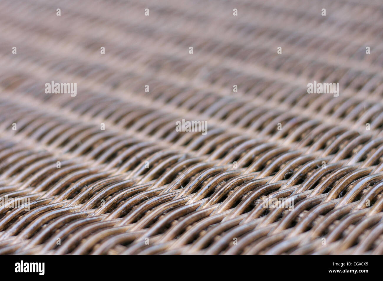 Cane or wickerwork background- showing the details of interlaced weave ...