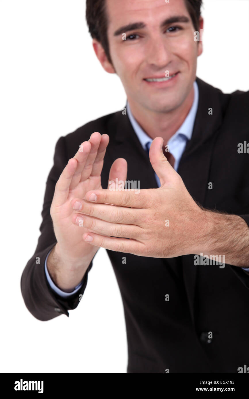 A businessman clapping hands Stock Photo - Alamy