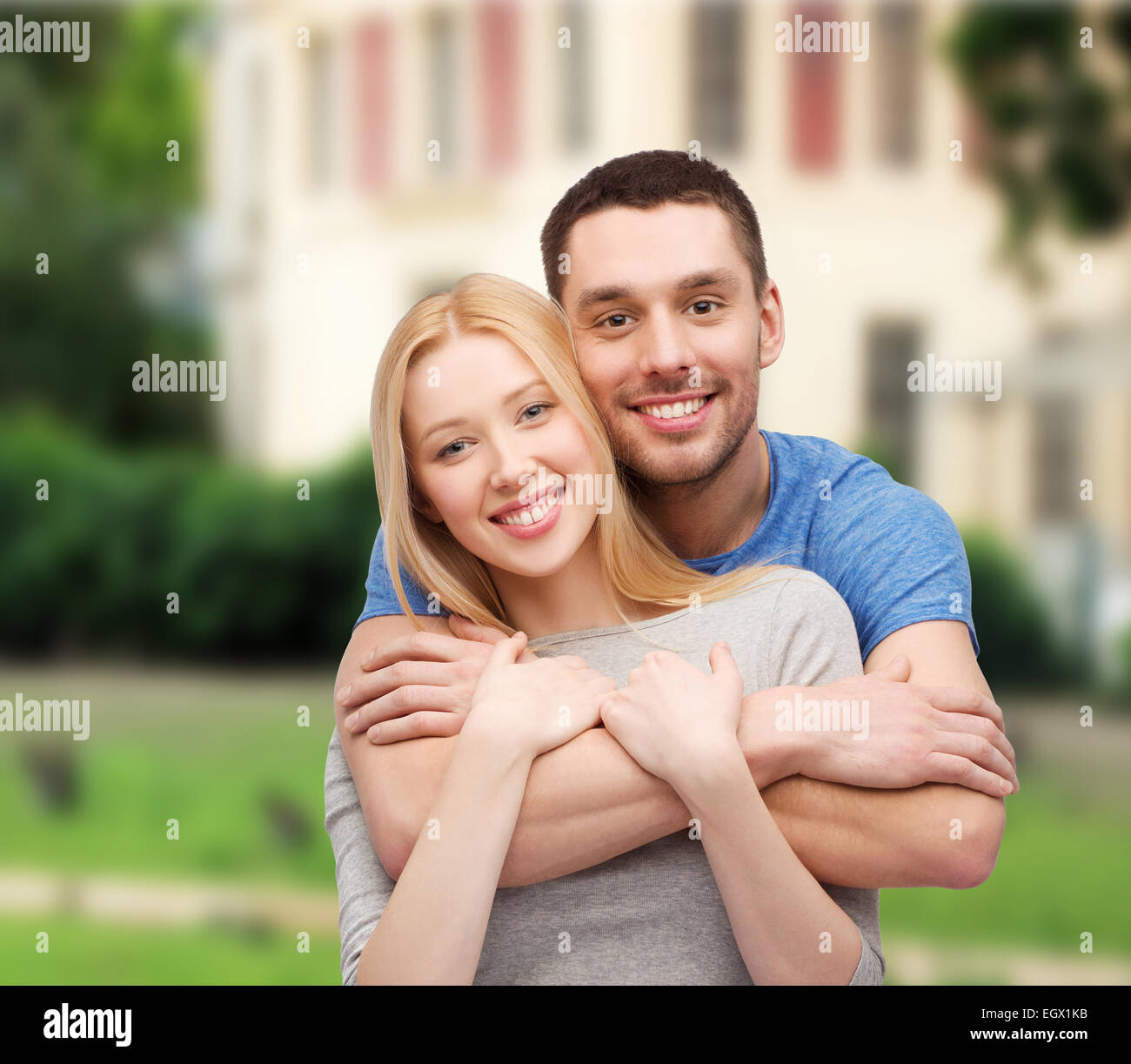 smiling couple hugging Stock Photo - Alamy