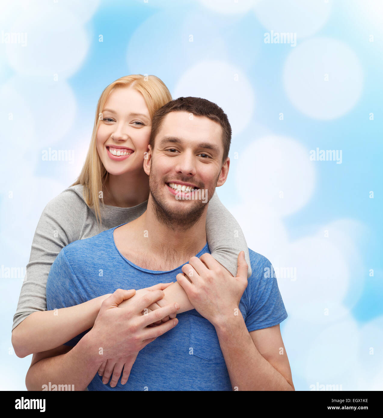 smiling couple hugging Stock Photo - Alamy