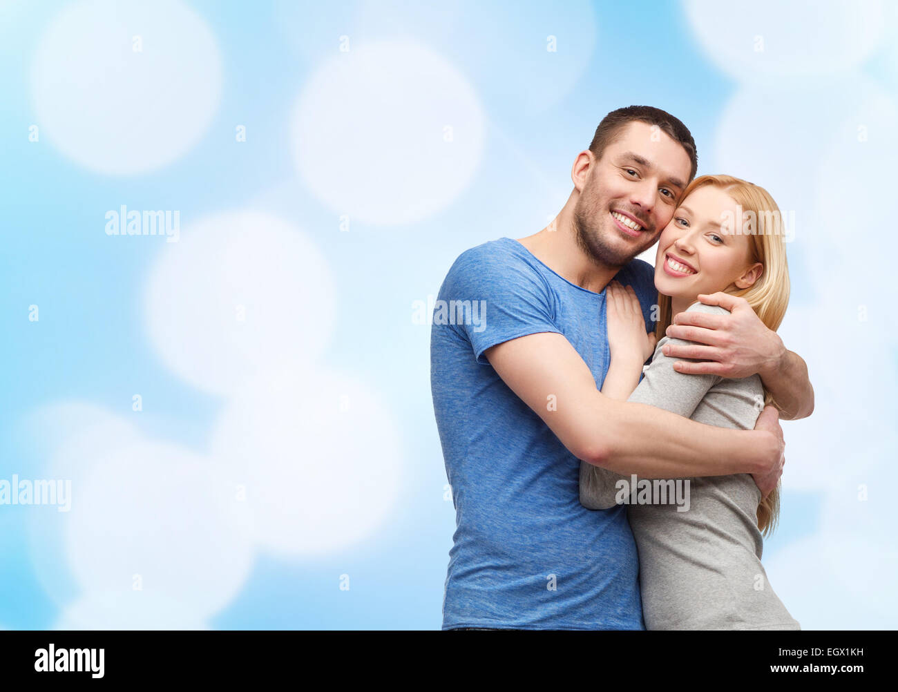 smiling couple hugging Stock Photo - Alamy