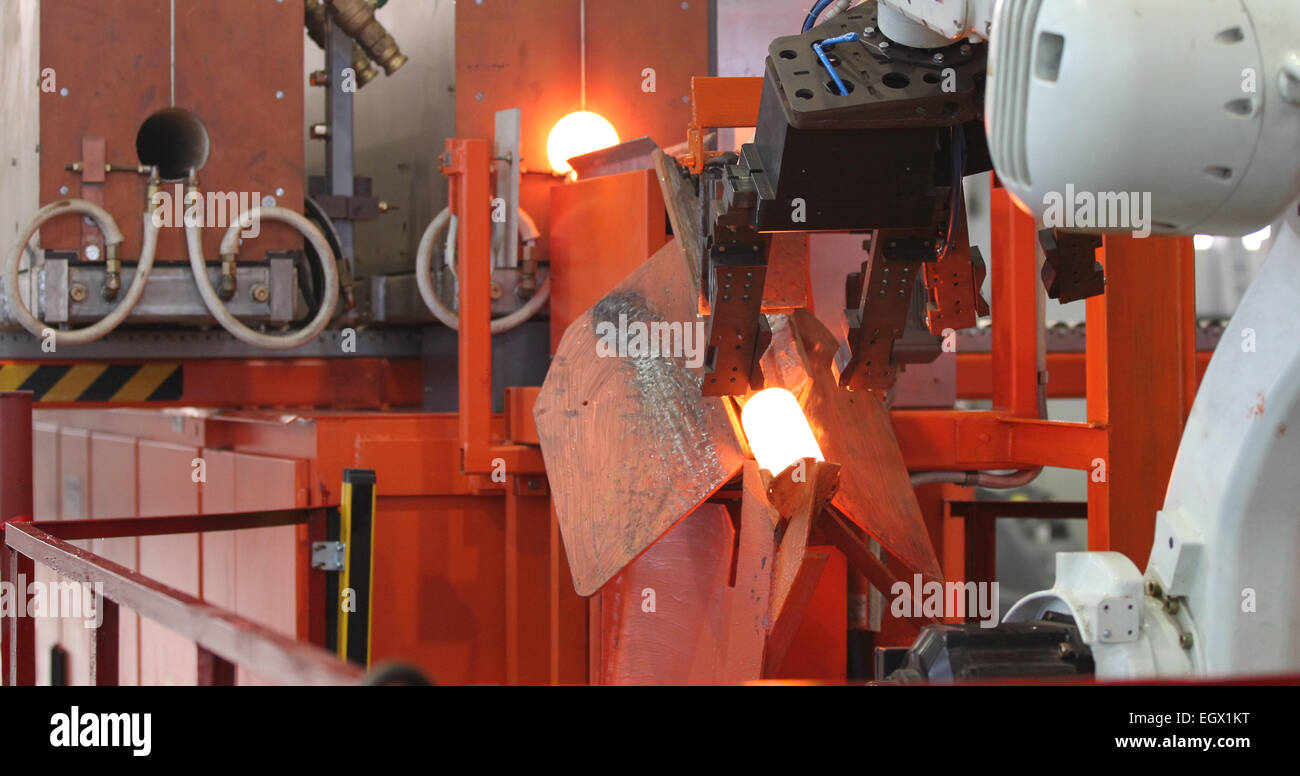 positioning unit and supplying the heated round billet Stock Photo - Alamy