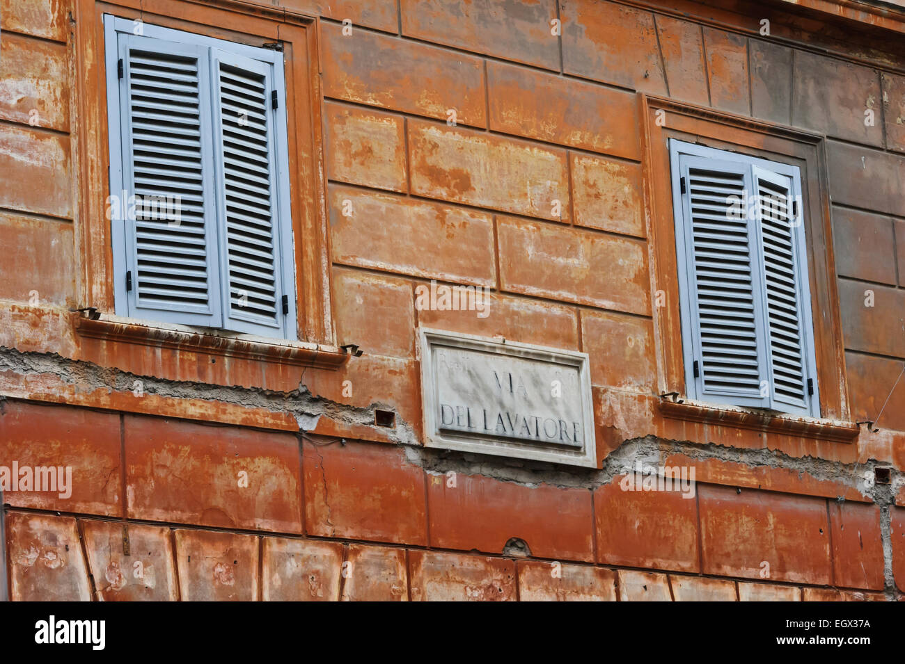 A traditional exterior of an Italian building with close window ...