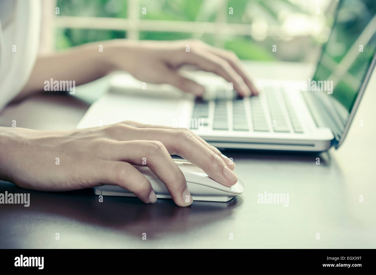 Working with computer Stock Photo - Alamy