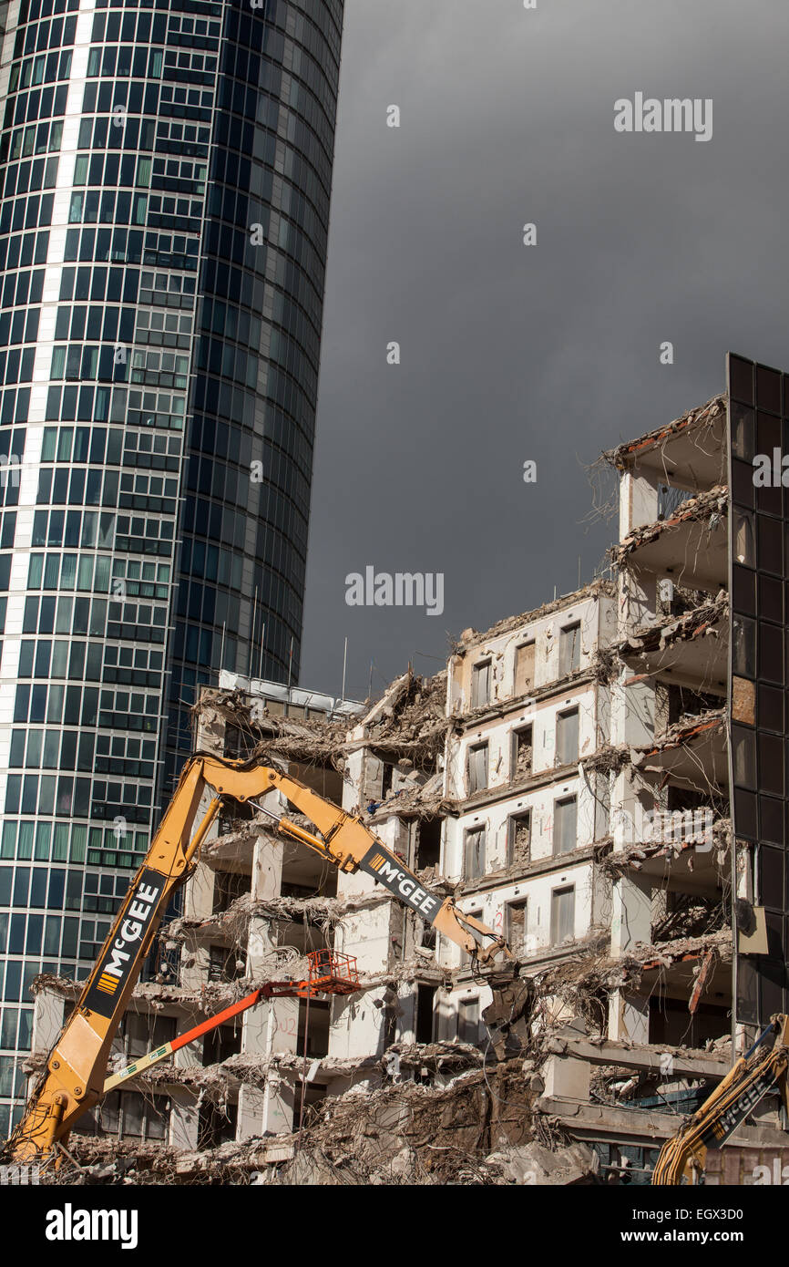 Demolition and Construction with mechanical digger in foreground Stock ...