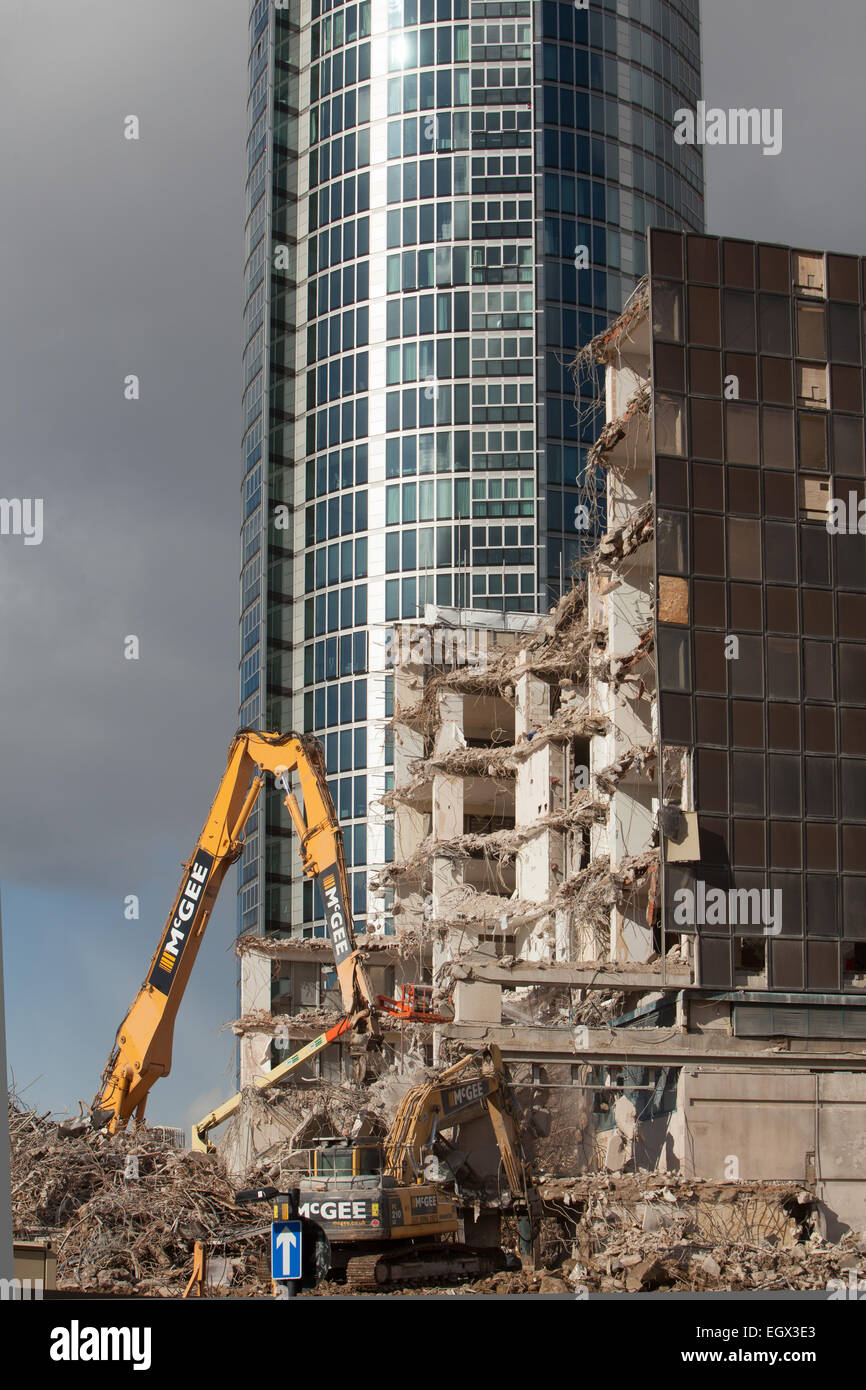Demolition and Construction with mechanical digger in foreground Stock ...