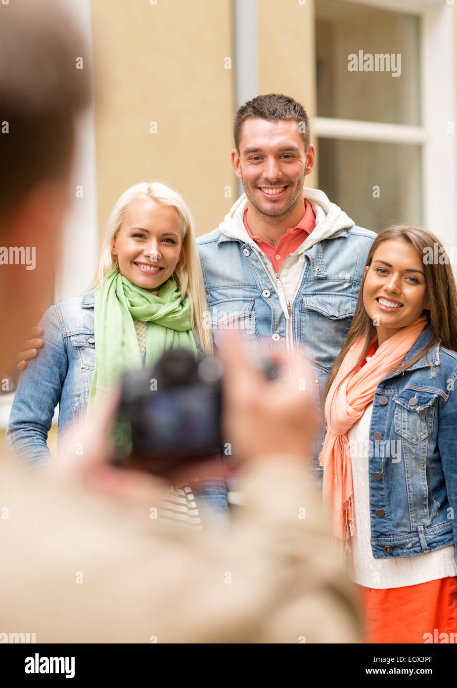 group of smiling friends taking photo outdoors Stock Photo - Alamy
