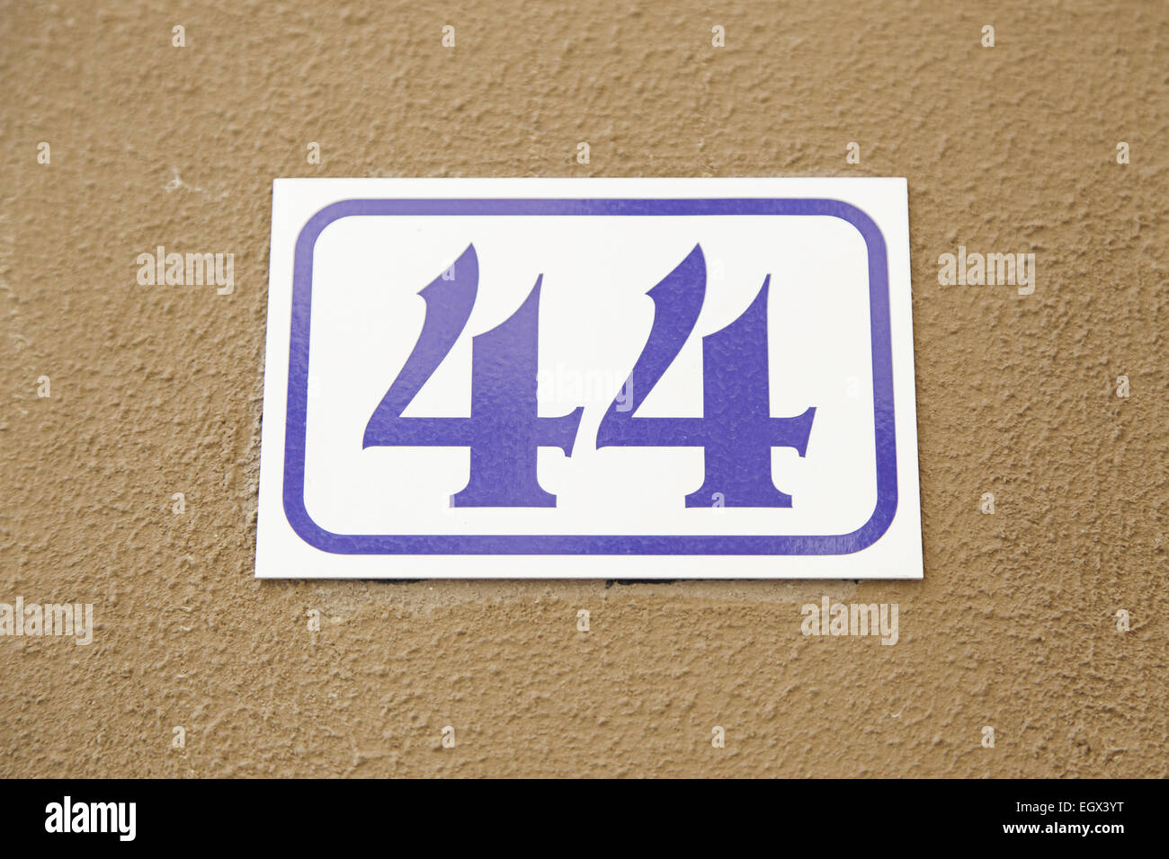 Number forty-four on the wall of a house, detail of a number of ...