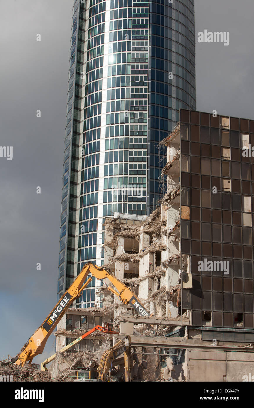 Demolition and Construction with mechanical digger in foreground Stock ...