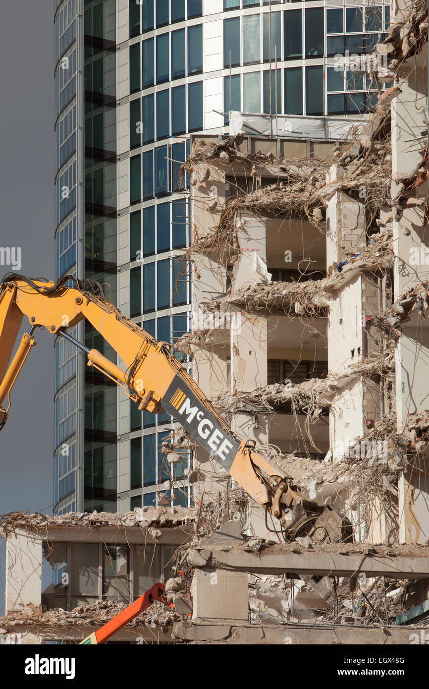 Demolition and Construction with mechanical digger in foreground Stock ...