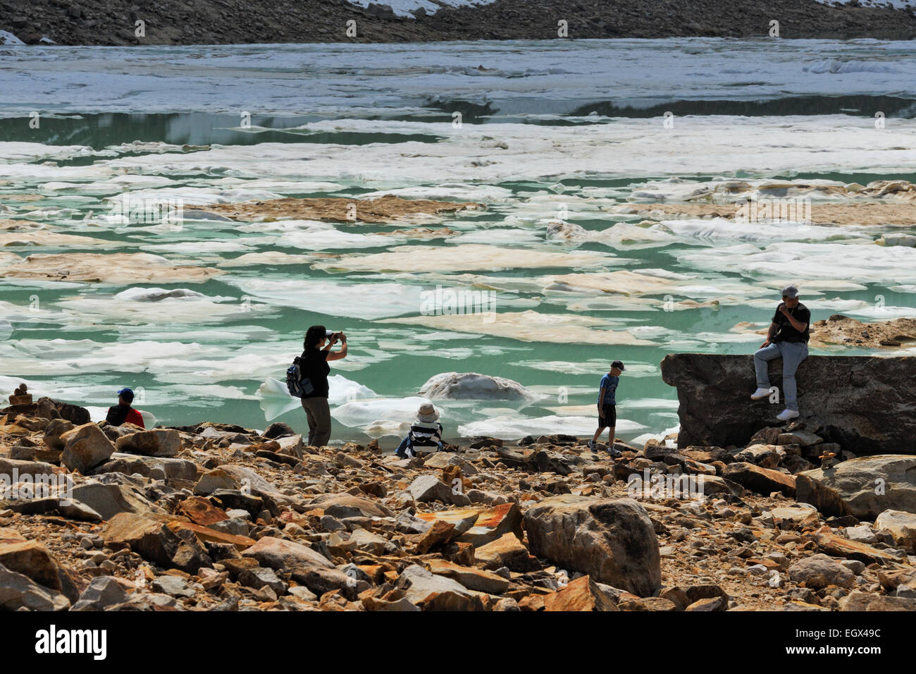Tourists visiting Cavell Lake below Mt. Edith Cavell, Jasper National ...