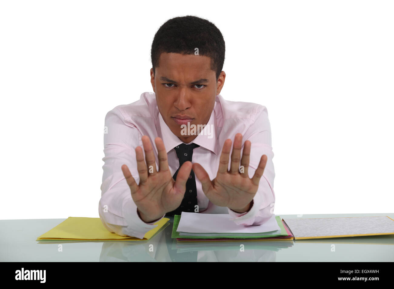 Man at desk making stop gesture Stock Photo - Alamy