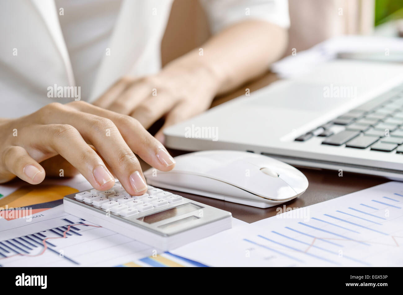 Working with calculator Stock Photo - Alamy